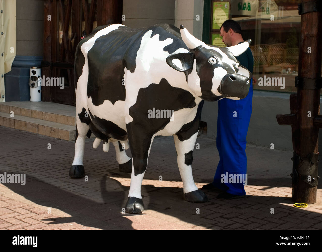 Black and White Plastic Cow and Man Arbat Street Moscow Stock Photo - Alamy