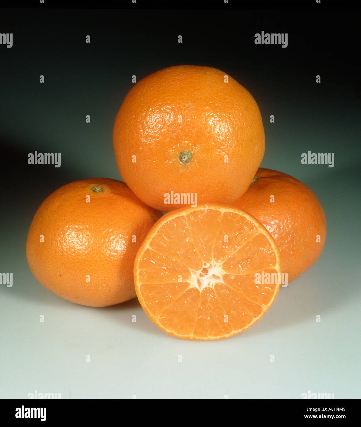 Group of whole cut sectioned mandarin fruit variety Ellendale Stock ...