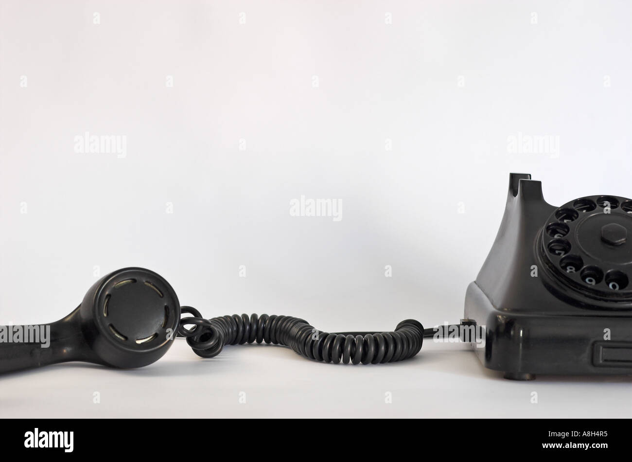 Black telephone with rotary dial Stock Photo - Alamy