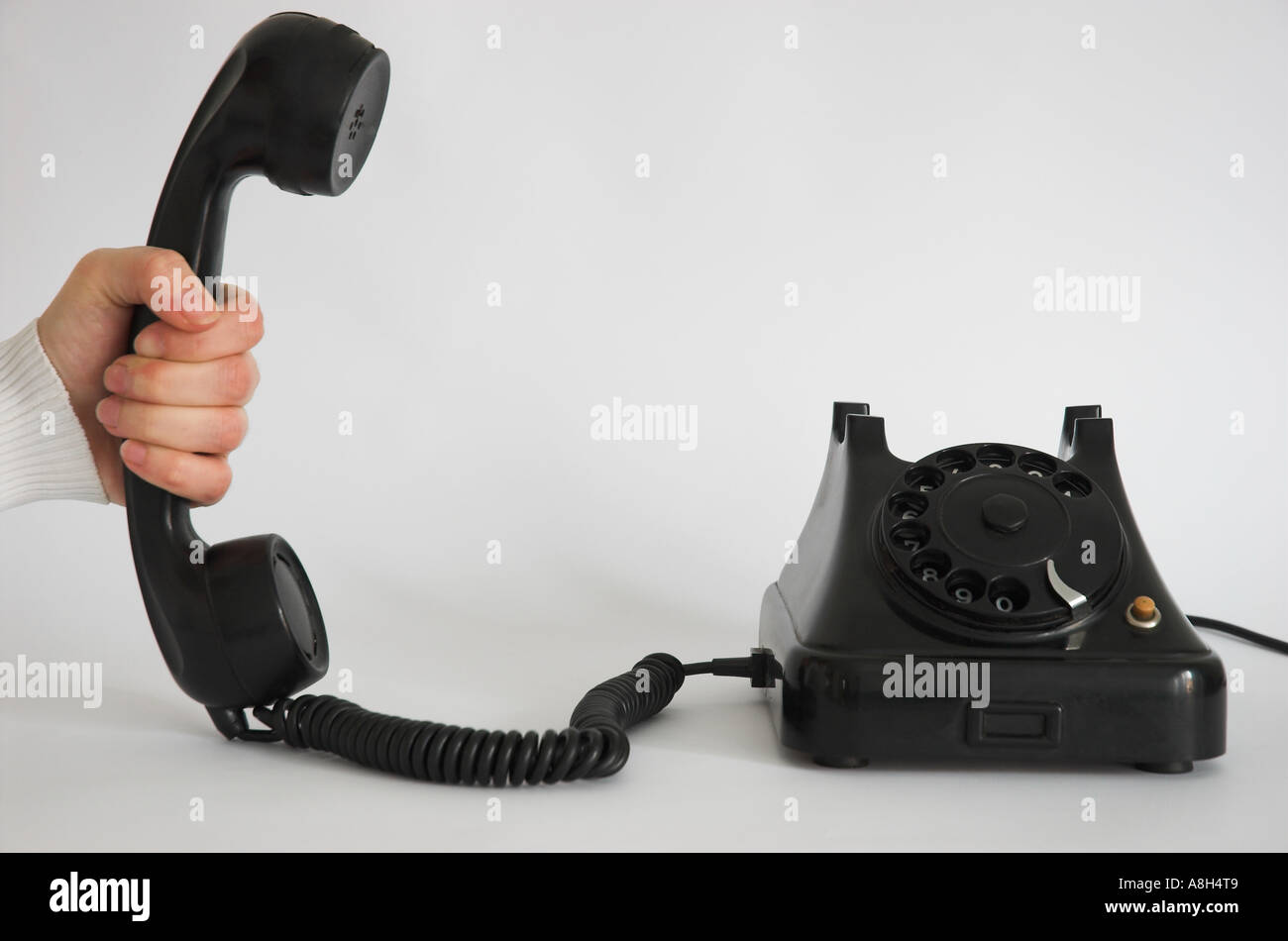 Hand holding telephone receiver Stock Photo - Alamy