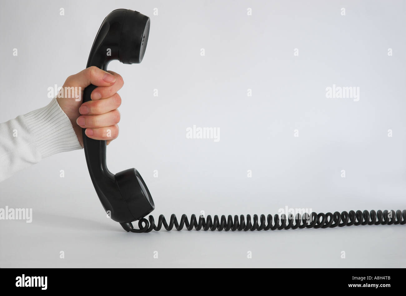 Hand holding telephone receiver Stock Photo - Alamy
