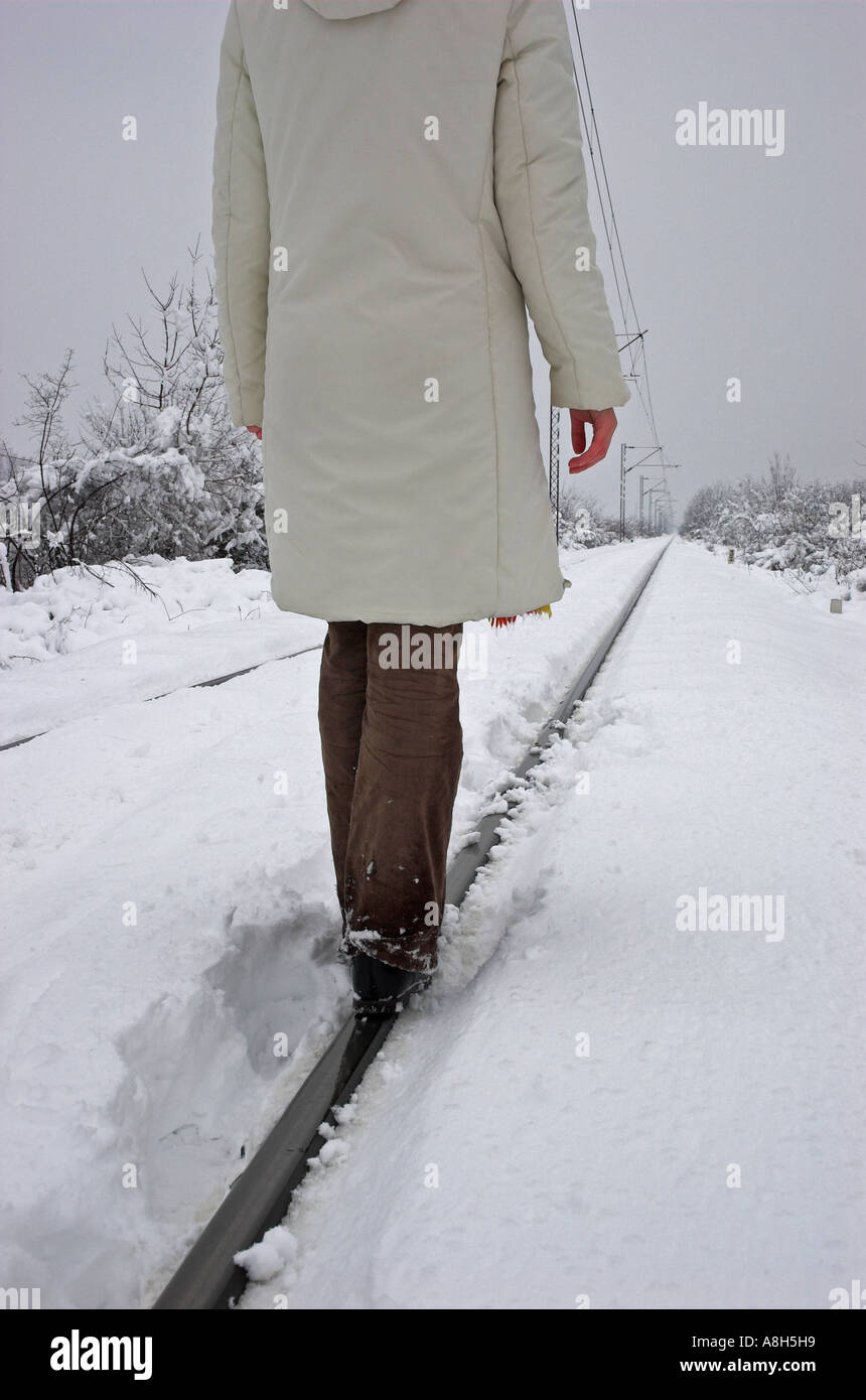 Woman walking on railway track hi-res stock photography and images - Alamy