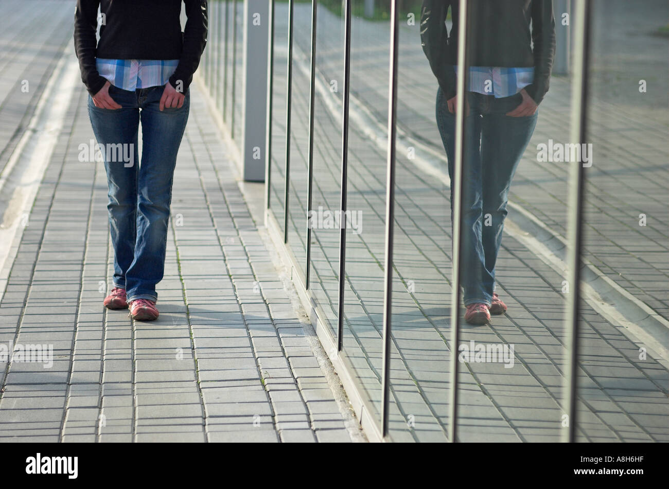 Low section view of young woman in jeans Stock Photo - Alamy