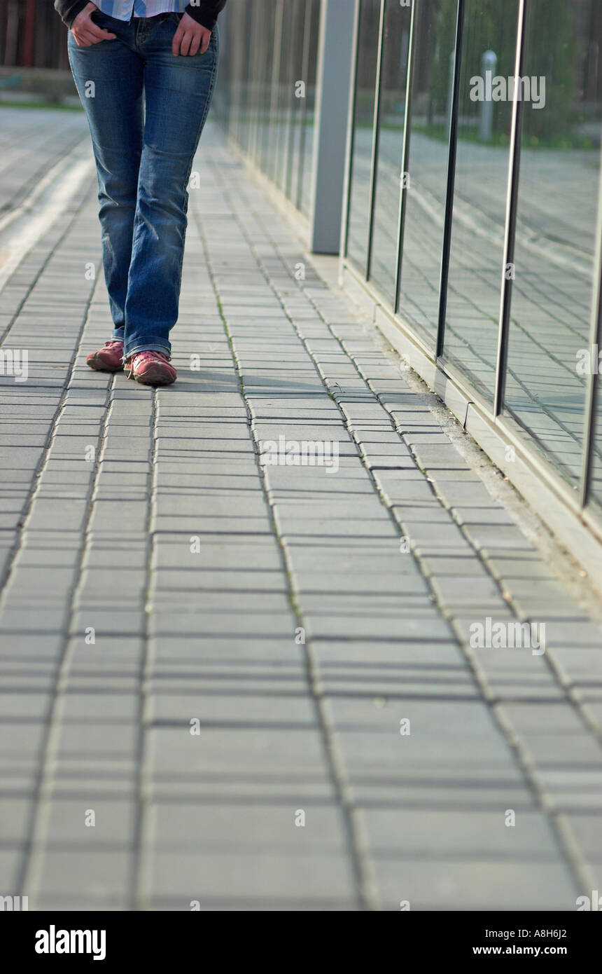 Low section view of young woman in jeans Stock Photo - Alamy