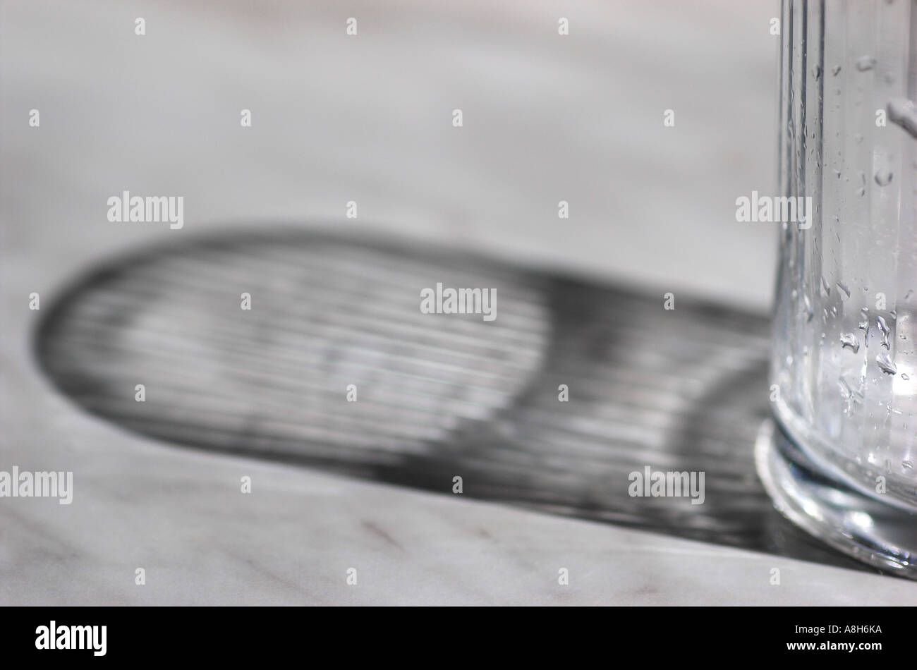 Glass with shadow Stock Photo - Alamy