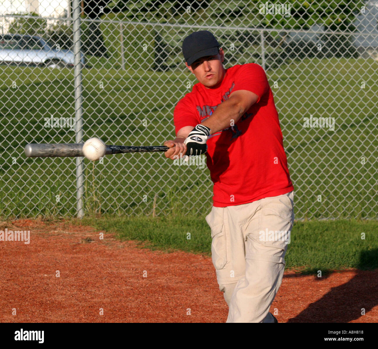 Man about to hit the softball Stock Photo - Alamy