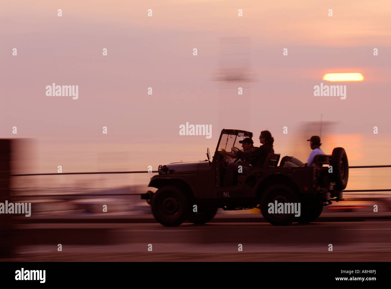 Fast driver Scheveningen sunset Stock Photo - Alamy