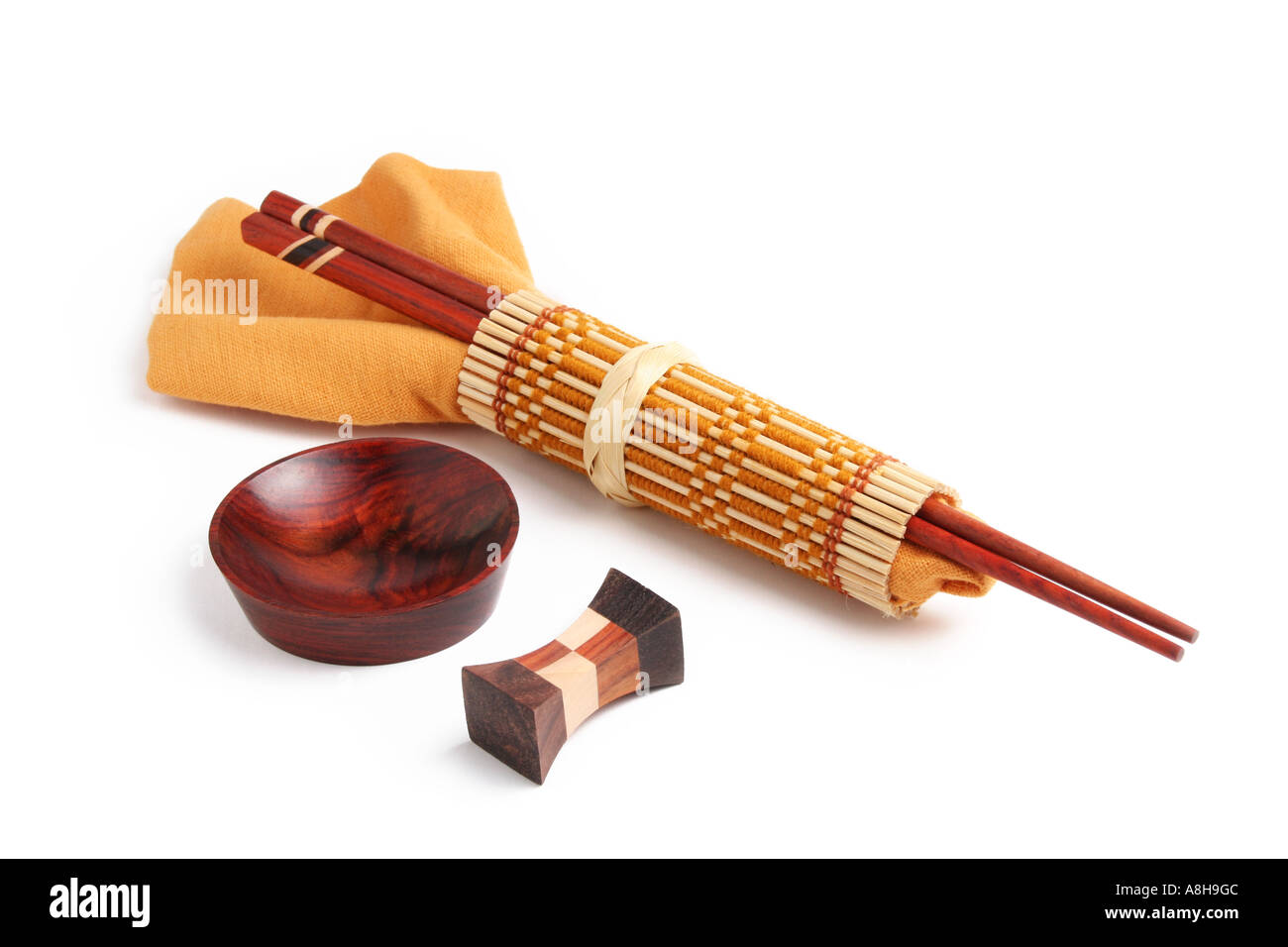Wooden chop sticks, sauce cup, sticks holder and napkin isolated on a ...