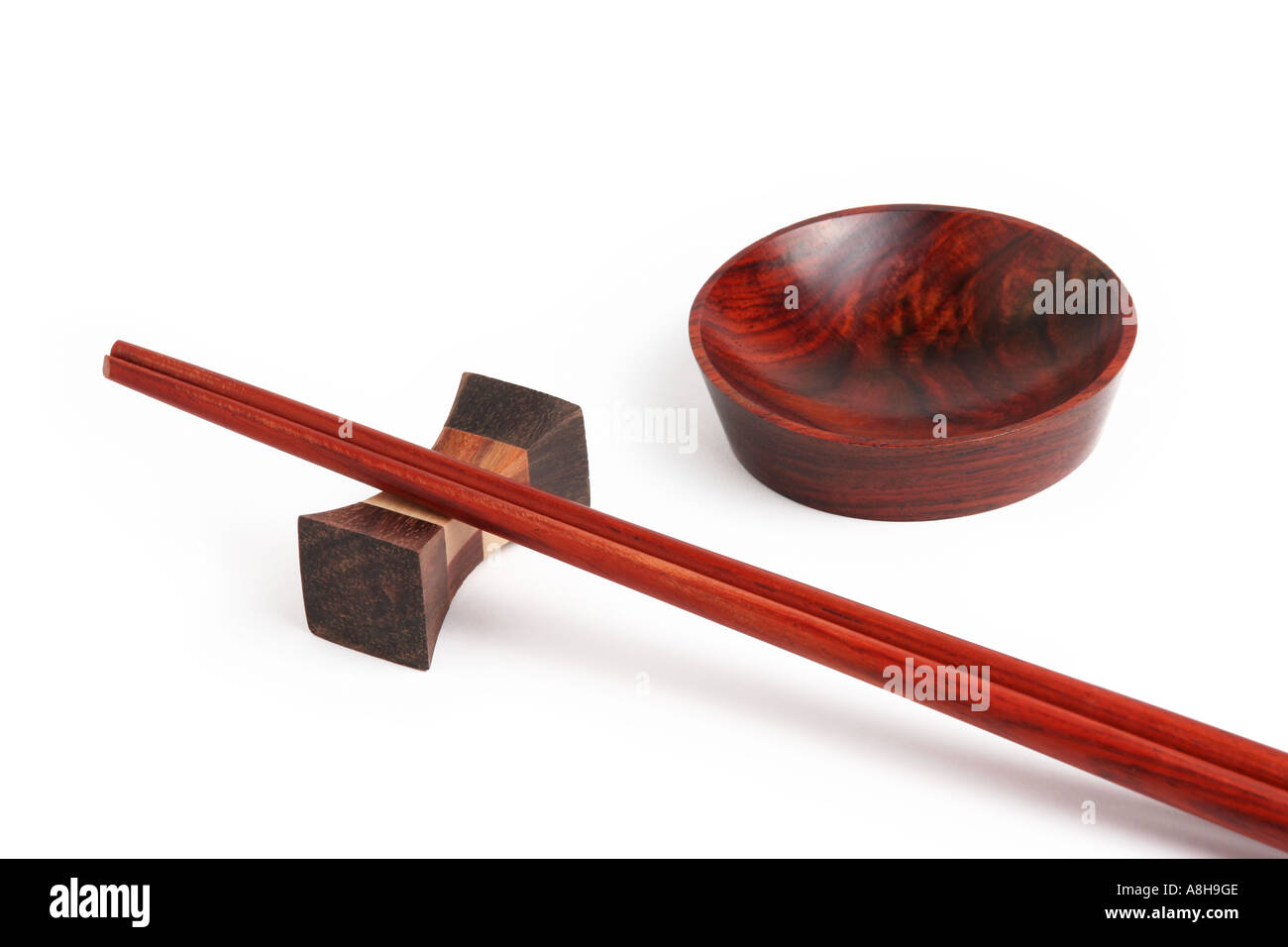 Wooden chop sticks, sauce cup and sticks holder isolated on a white ...