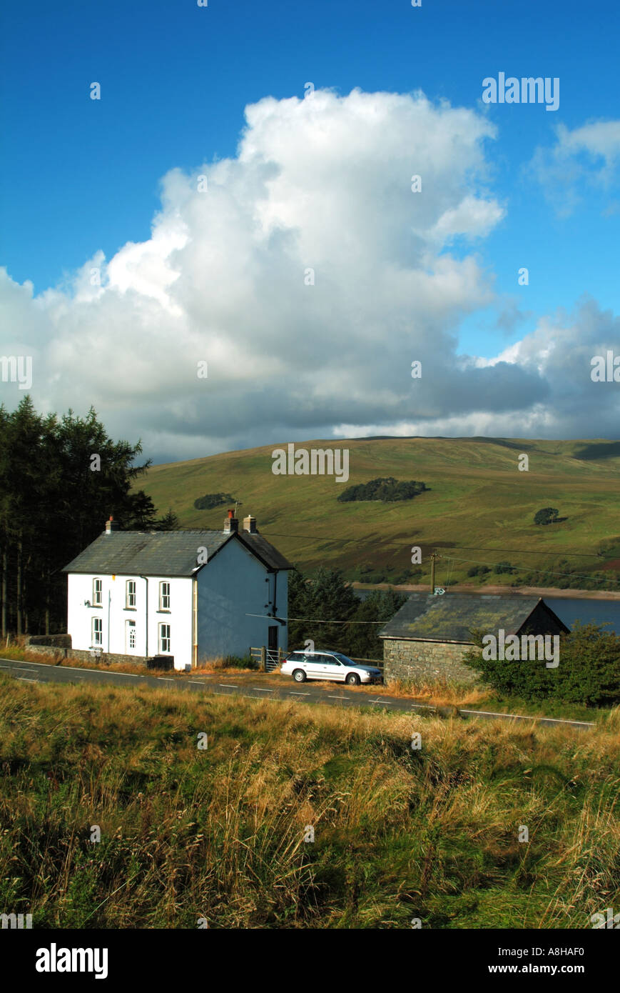 Typical remote farm cottage with essential car parked adjacent Brecon ...