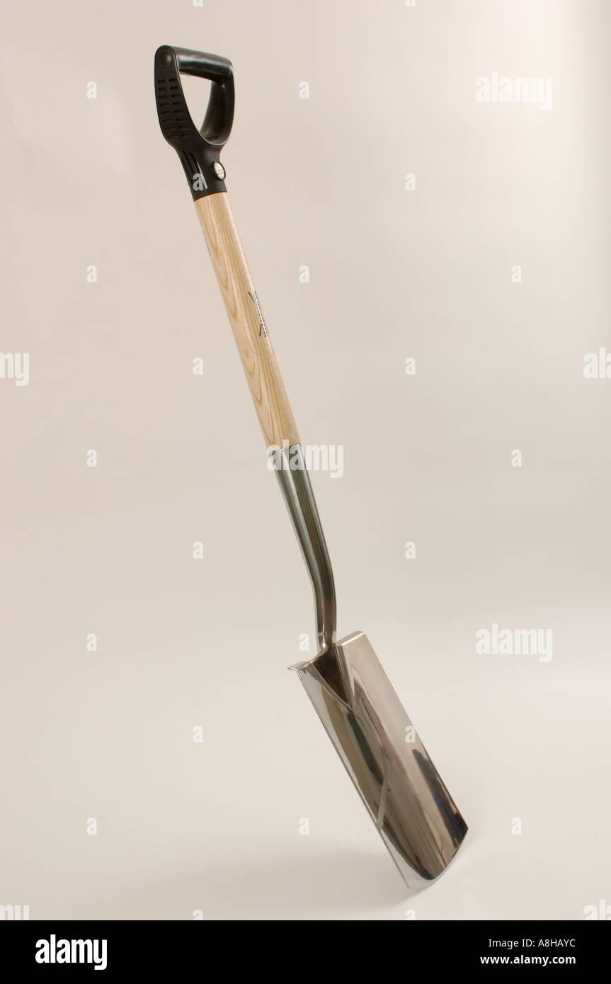 Stainless steel spade on a white plain background Stock Photo - Alamy