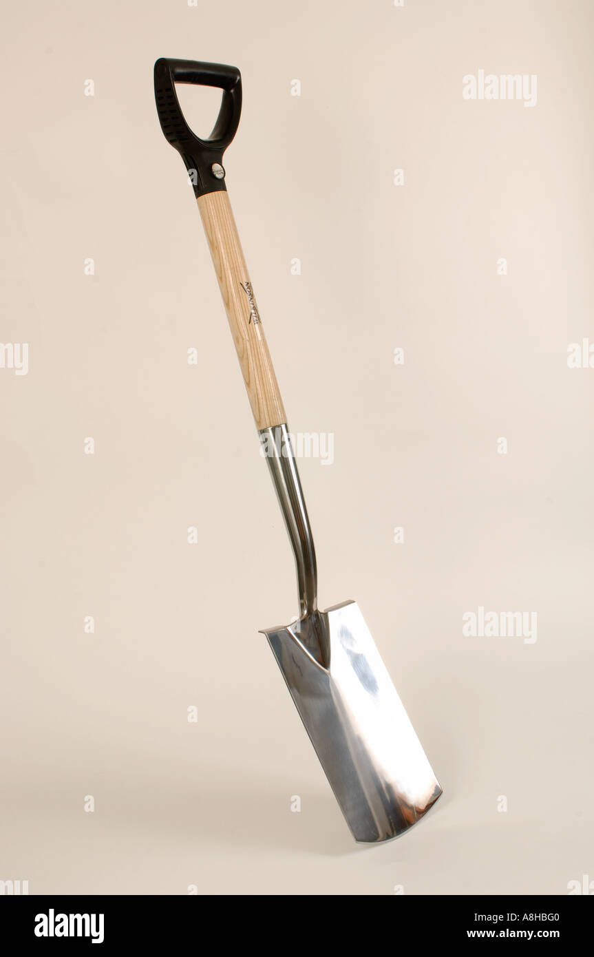 Stainless steel spade on a white plain background Stock Photo - Alamy