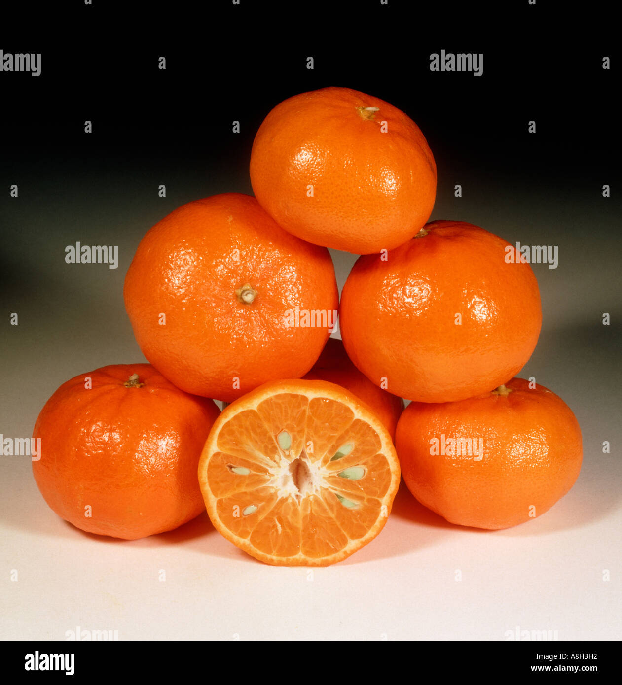 Group of mandarin fruit whole sectioned variety Sunburst Stock Photo ...