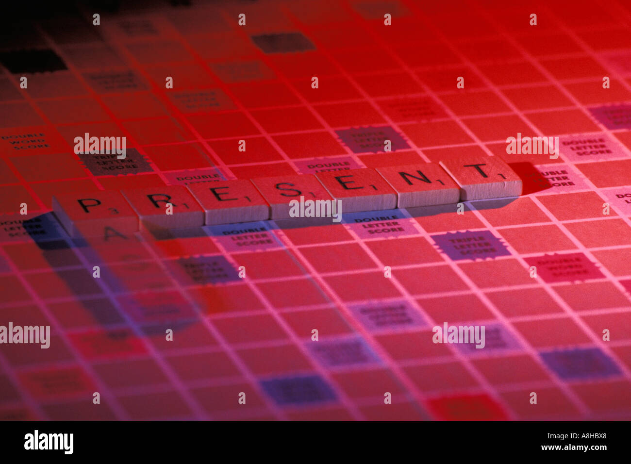 The words Present and past spelled out with scrabble letters on a ...