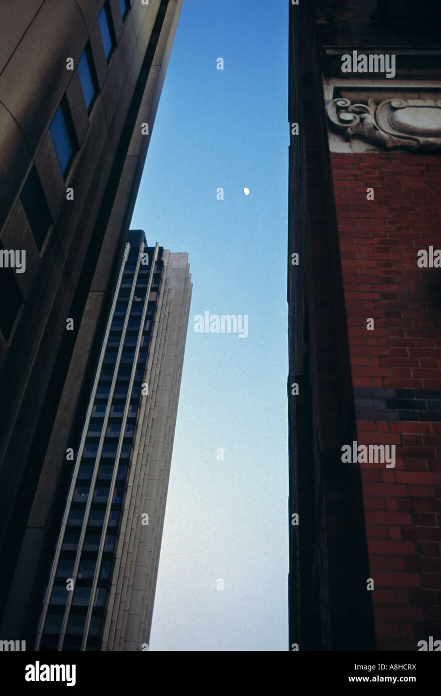 moon between London buildings. England Stock Photo - Alamy