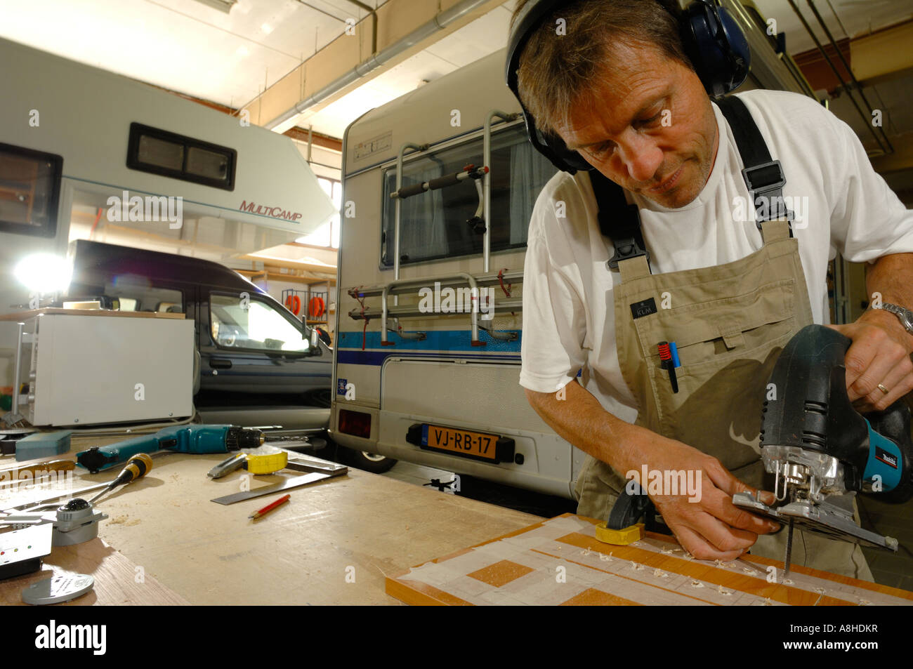 Men at work by Camper builder company Men Sawyer at work on a bus ...