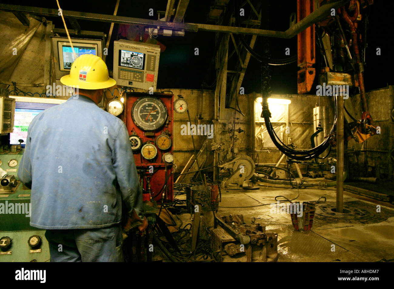 Worker with one drilling rig Stock Photo - Alamy