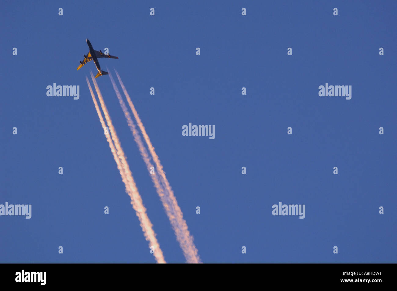 High flying airplane in the morning Stock Photo - Alamy