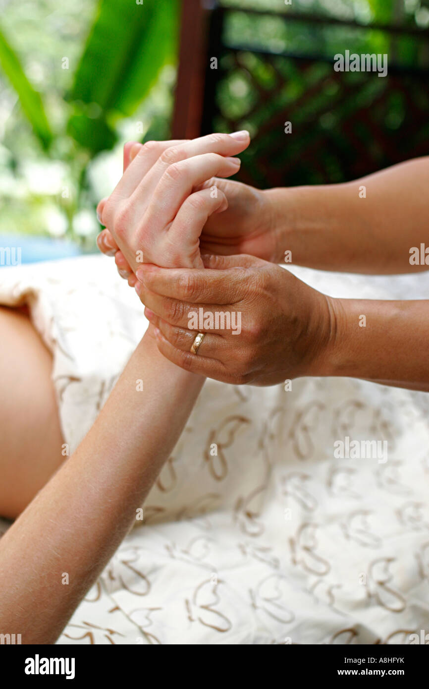 A massage therapist massaging hands Stock Photo - Alamy