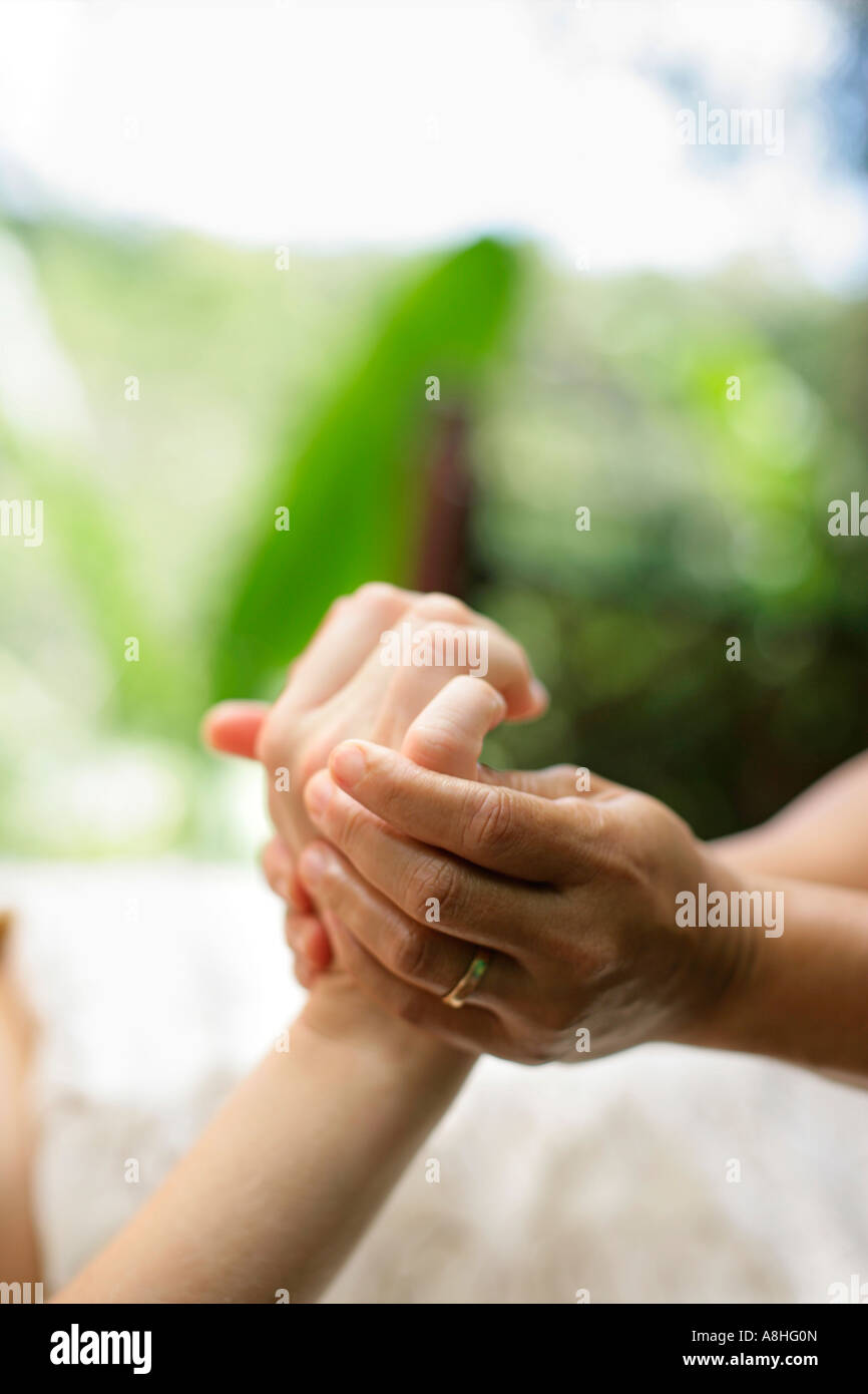A message therapist massaging hands Stock Photo - Alamy