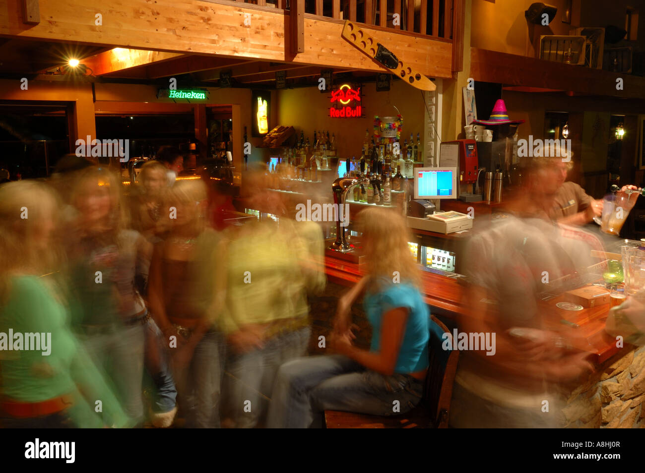 Young people on the bar drinking in Cafe Restaurant blur blurred motion ...