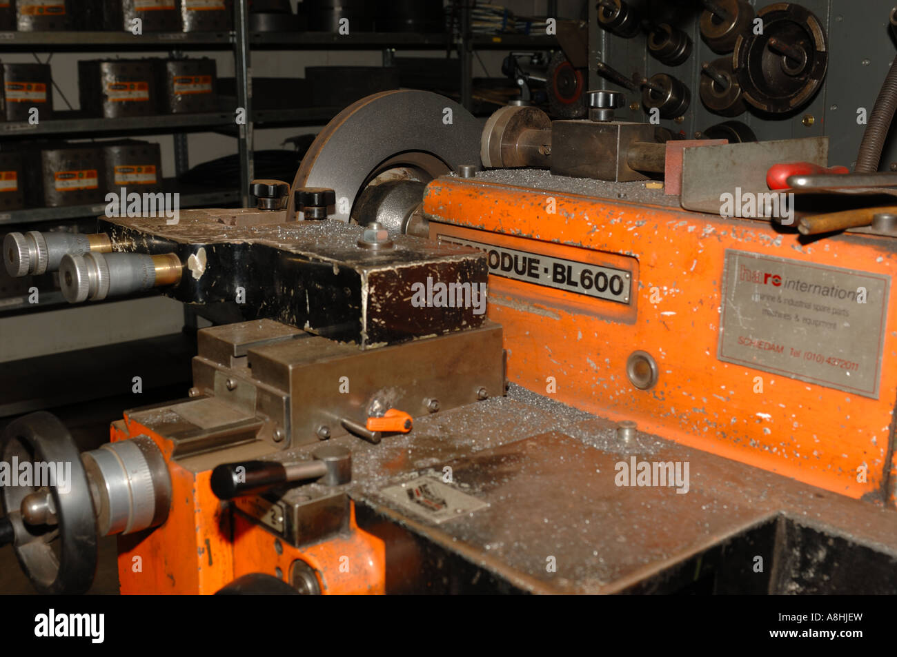 Carparts car revision workplace brake disk turn off away Stock Photo ...