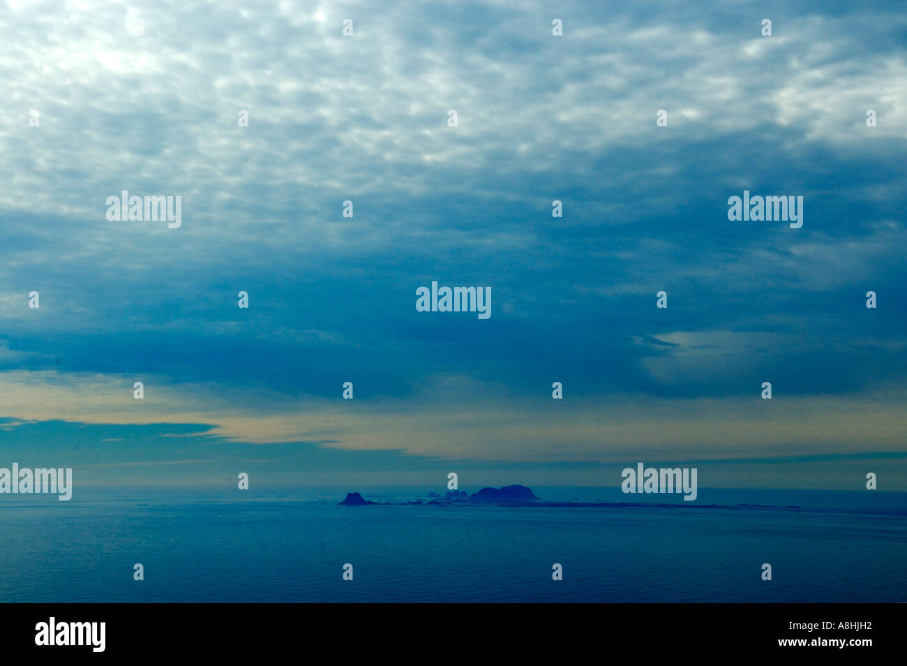 Wide open sky with dark clouds and islands Rost Lofoten Norway Stock ...