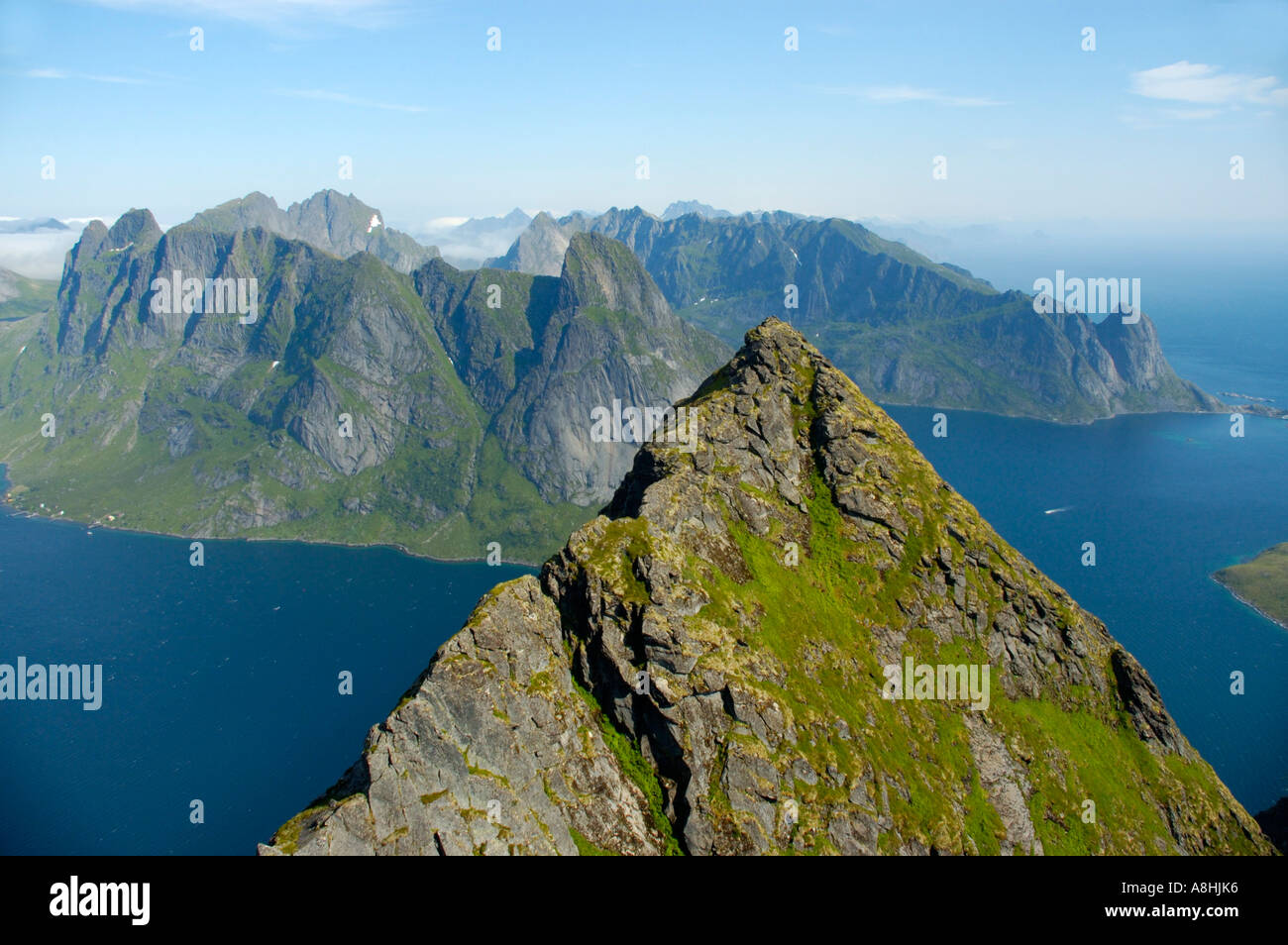 Rough summit Navaren and Reinefjorden with mountains Moskenesoya ...