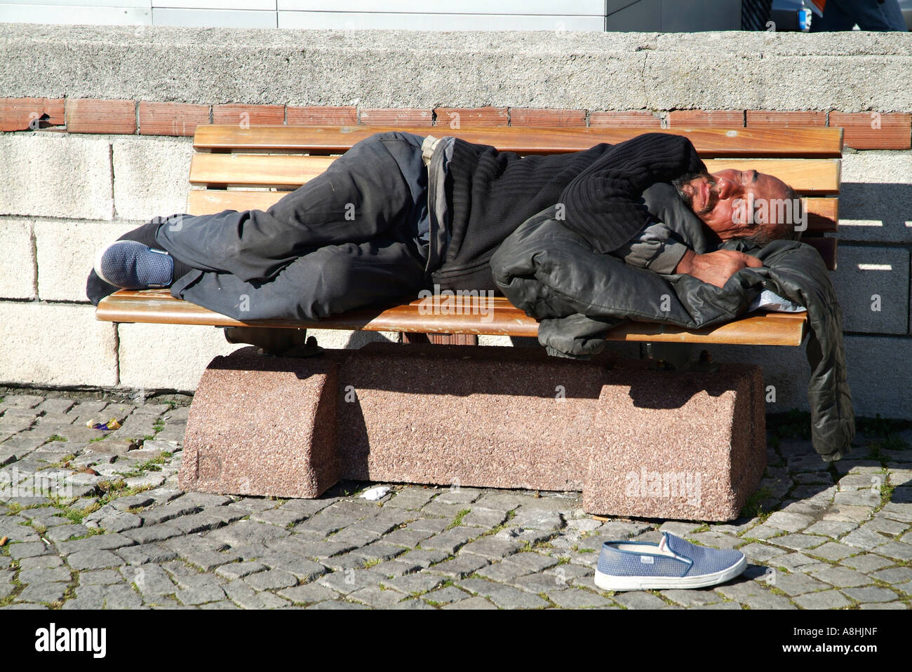 A homeless man sleeping on a bench Istanbul Turkey Stock Photo - Alamy