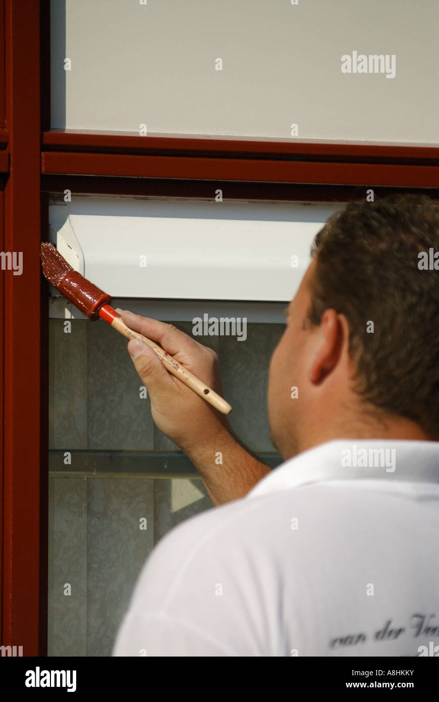 Painter at work shot from the back body Stock Photo - Alamy