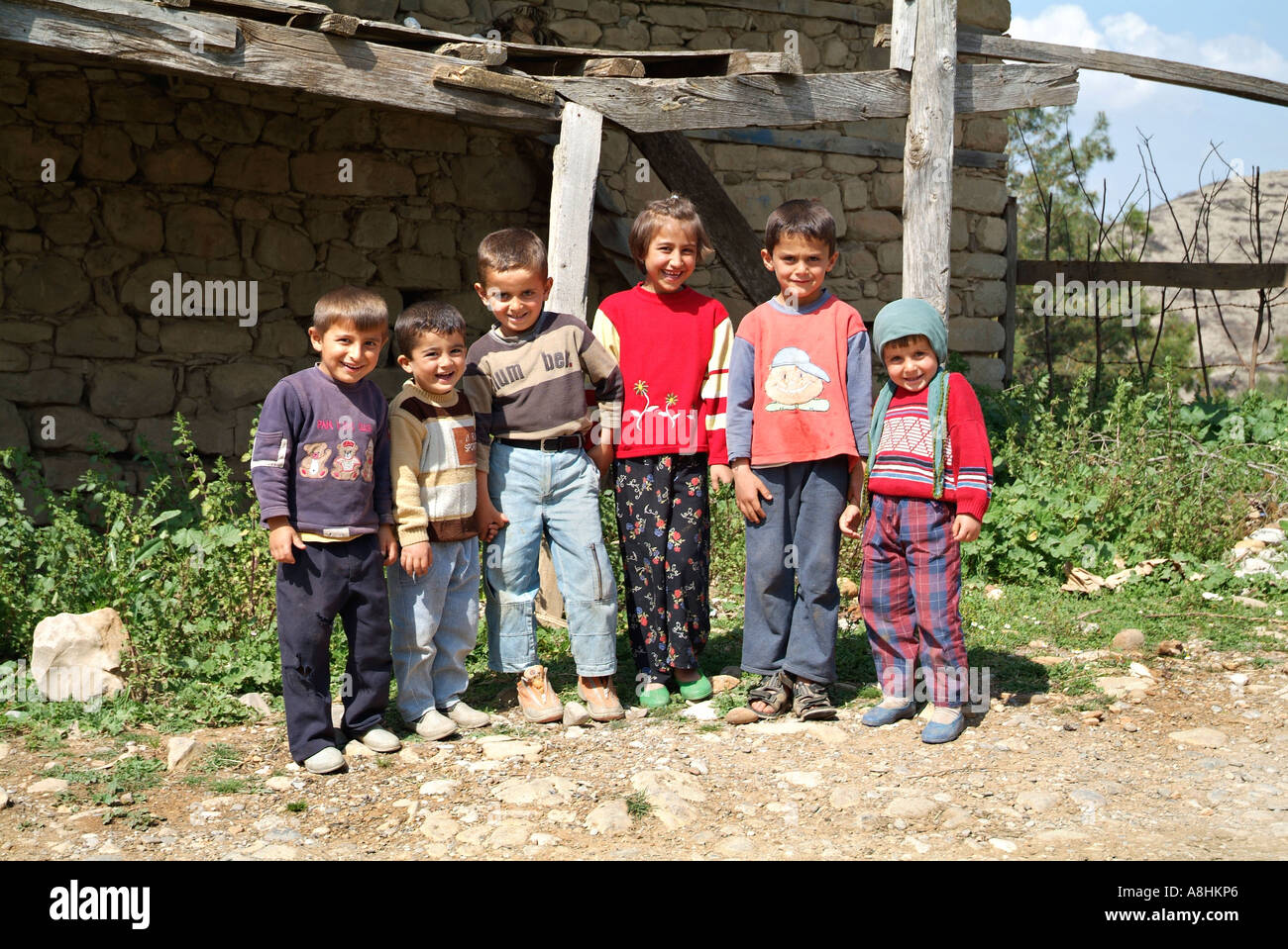Turkish villagers Group of children outside their home in a rural ...