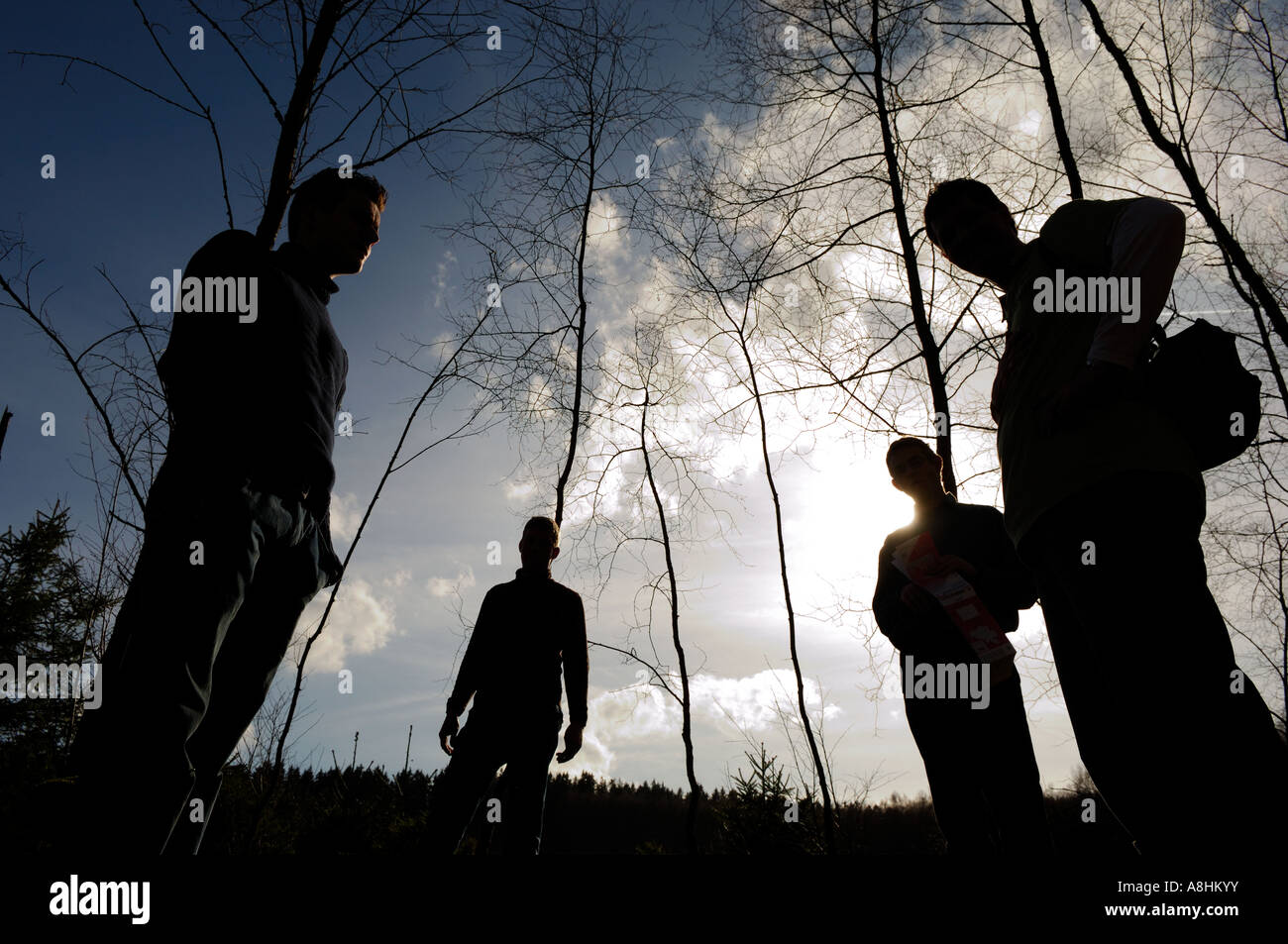 Group with men standing round the dead men grave burial pit Stock Photo ...