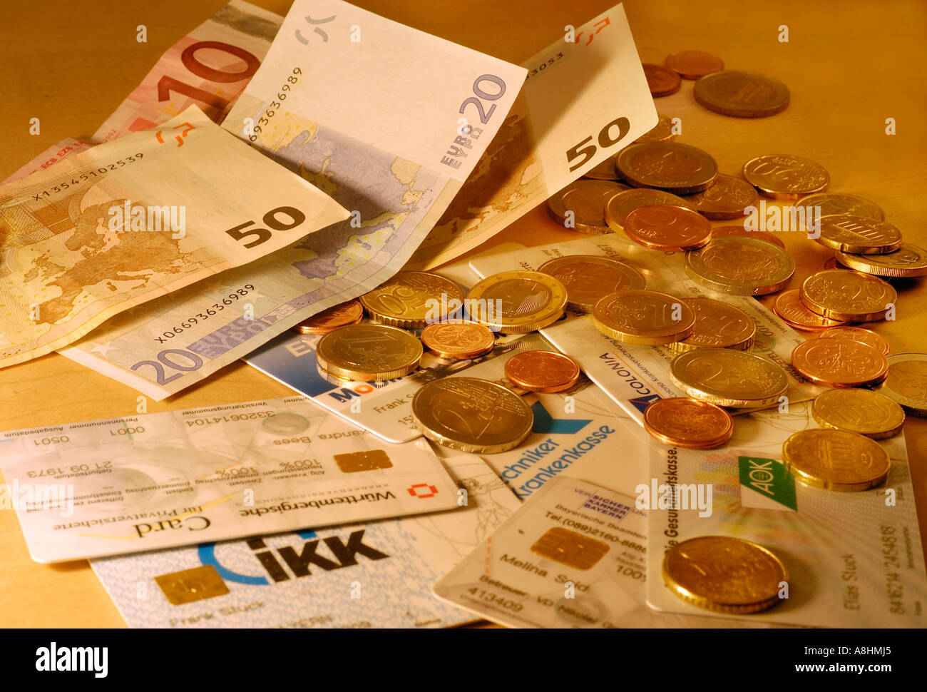 Different chip cards of German health insurance and Euro money Stock ...