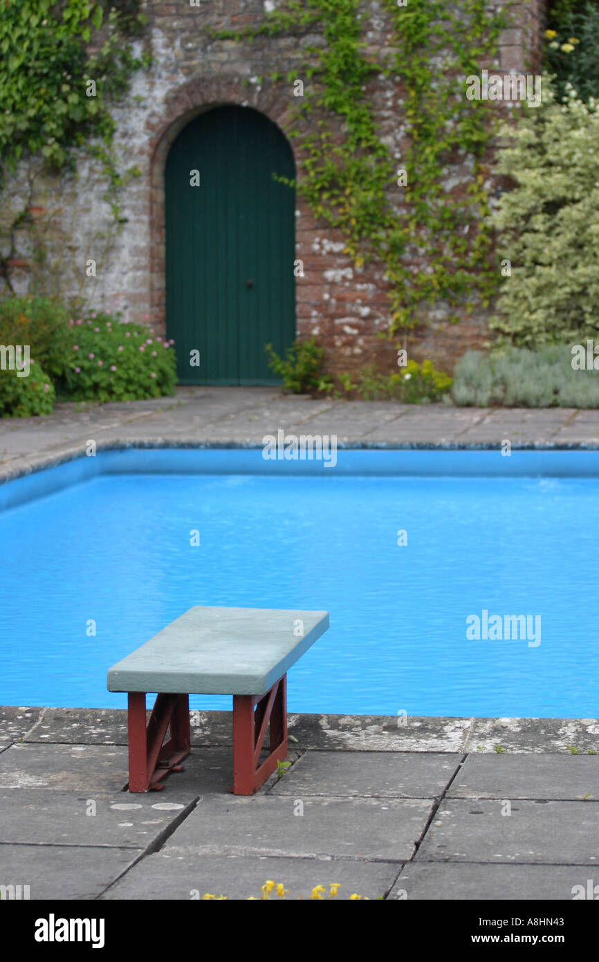 Luxury swimming pool with diving board Stock Photo - Alamy