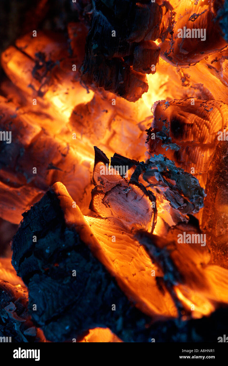 Smouldering wood inside the camp fire Stock Photo - Alamy