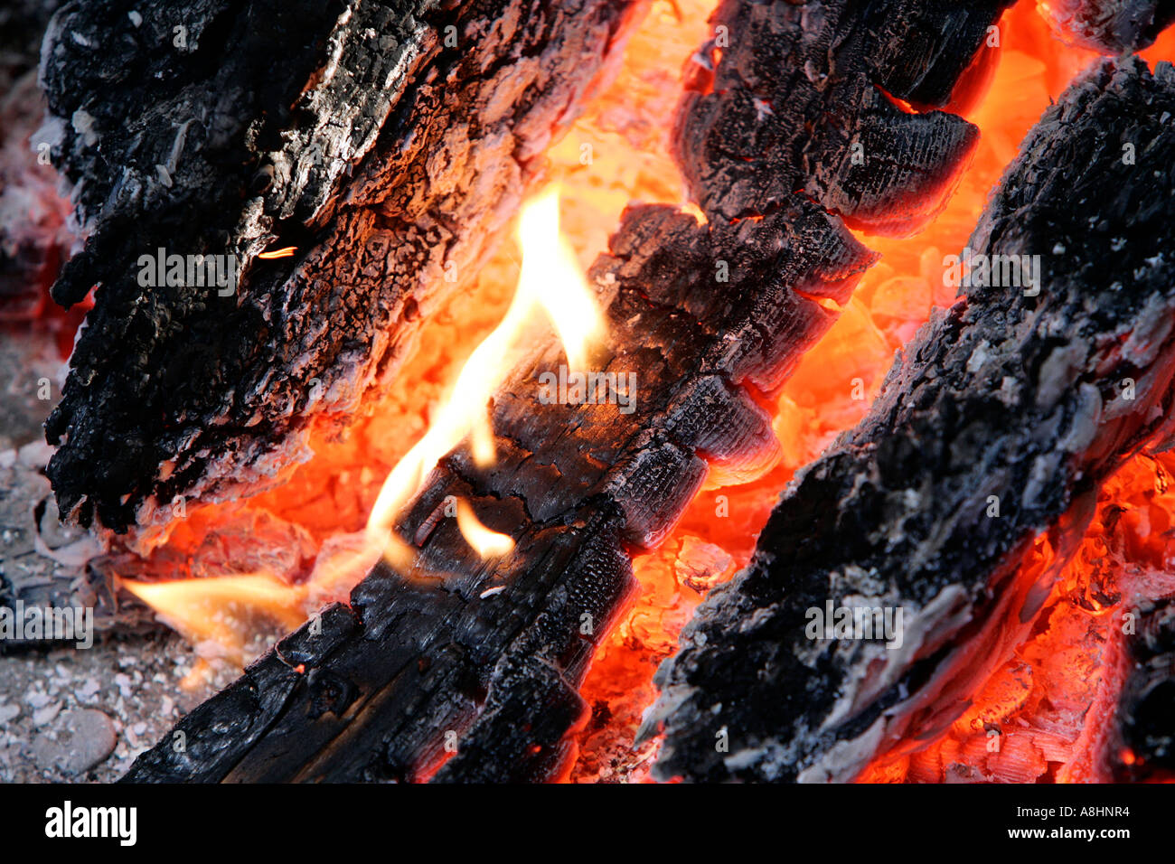 Pieces of wood burn iinside the camp fire Stock Photo - Alamy