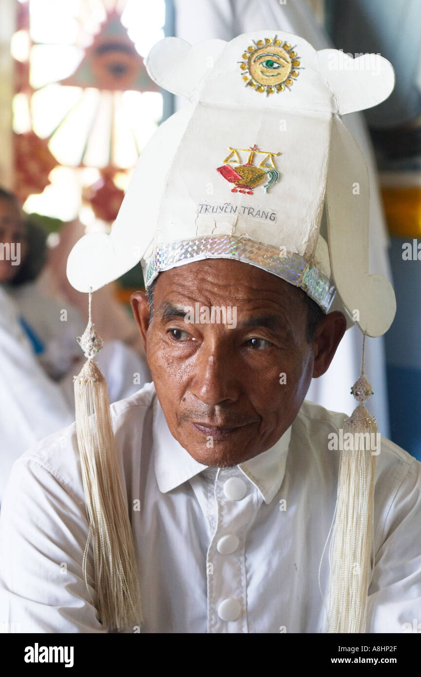 Portraits of memebers of the Cao Dai religion worshiping in the Cao Dai ...