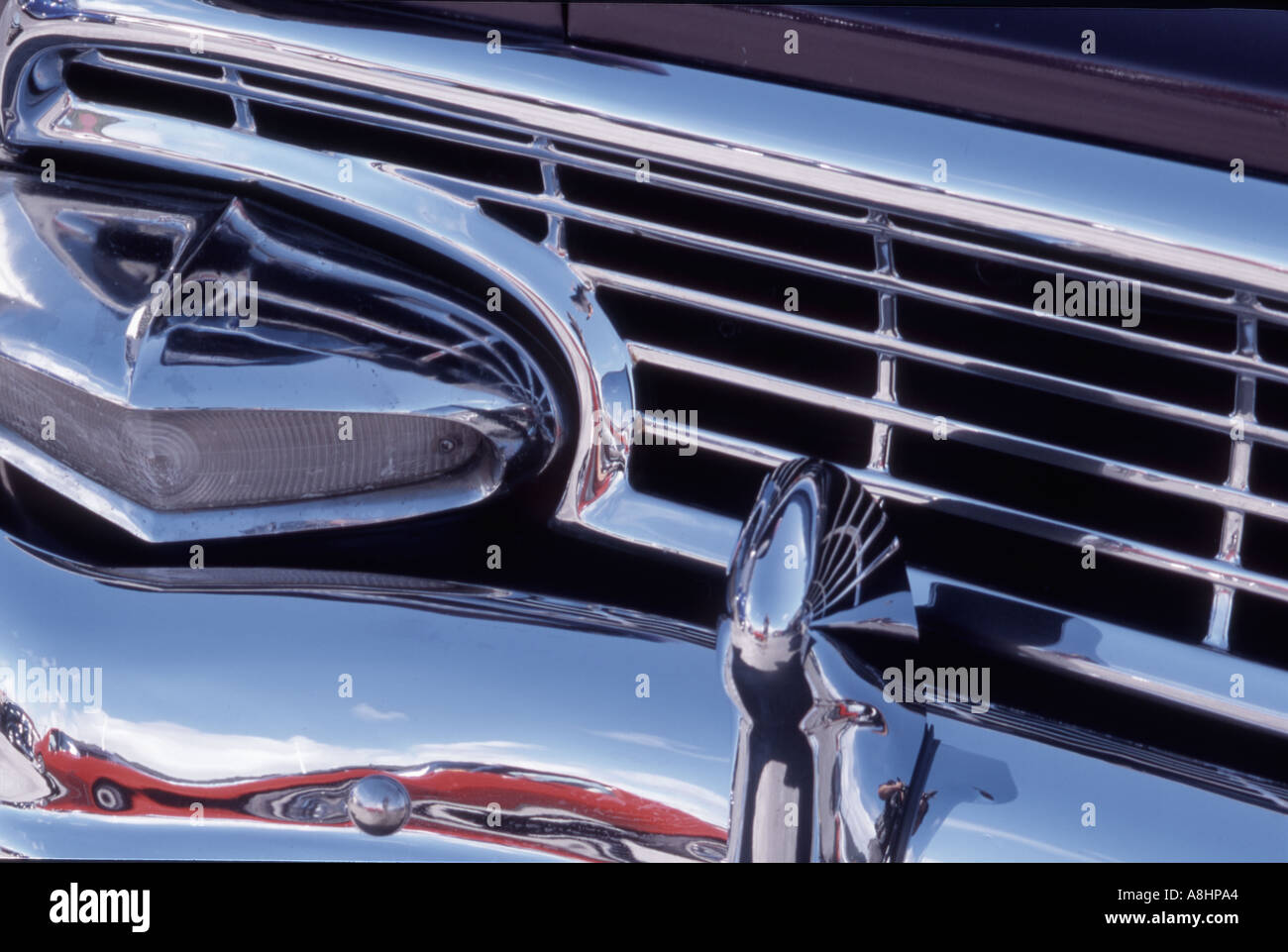 Abstract detail of vintage custom car showing polished headlights and ...