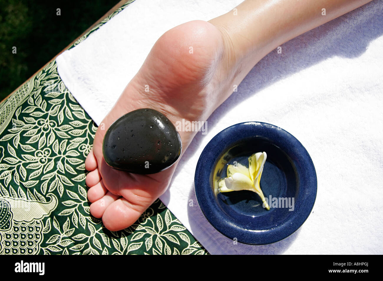 View of a heavy pebble on a person s foot Stock Photo - Alamy