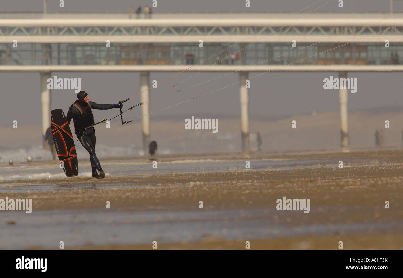 Walking kite people on the beach Stock Photo - Alamy