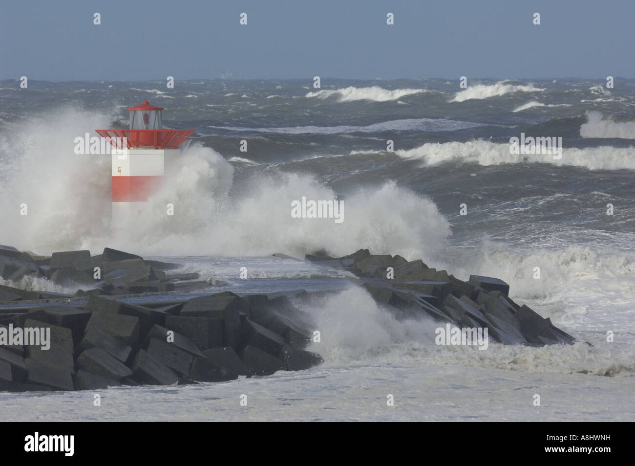 Storm in Scheveningen at the coast of Holland on the jetty whit ...