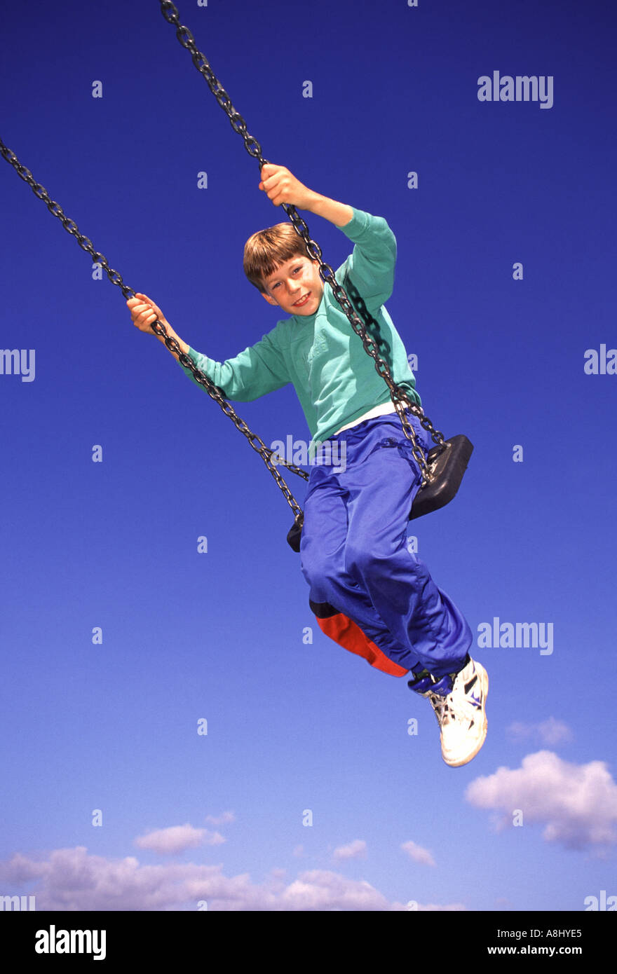 young boy on swing Stock Photo - Alamy