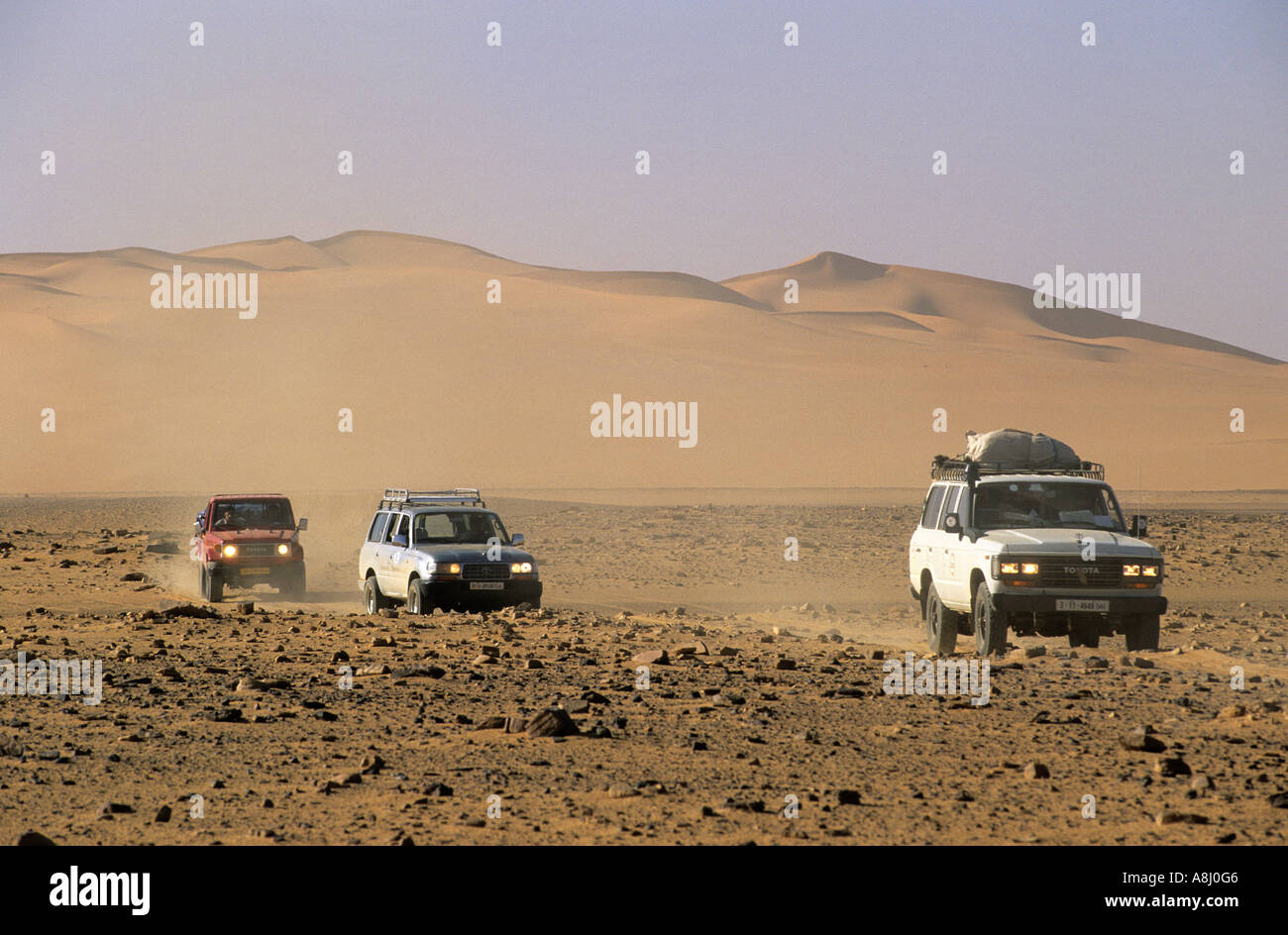 Libya Fezzan Sahara desert Erg Murzuq Jeeps driving through desert ...