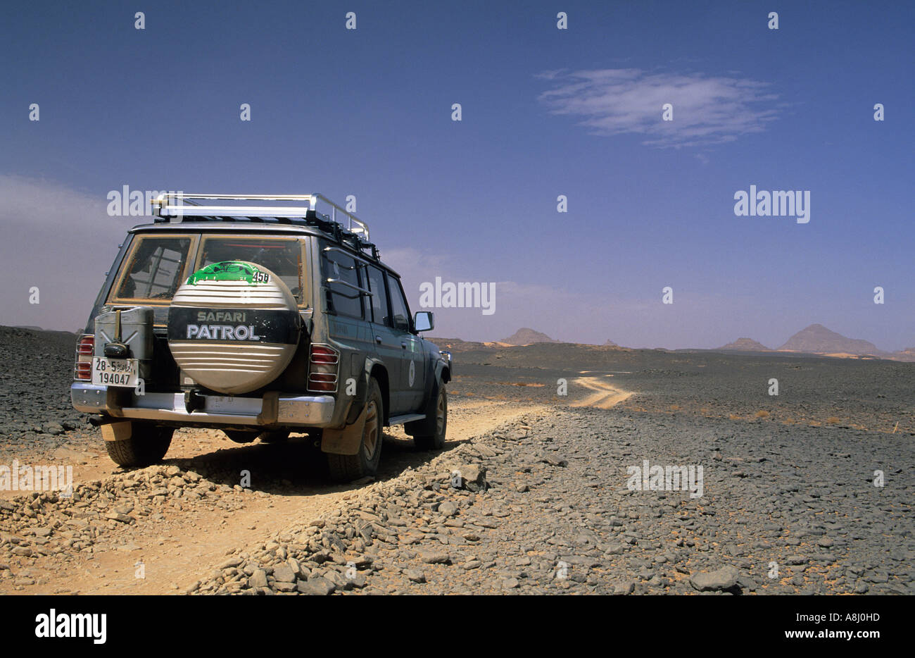 Libya Fezzan Sahara desert Akakus Jeep driving on stone desert Stock ...