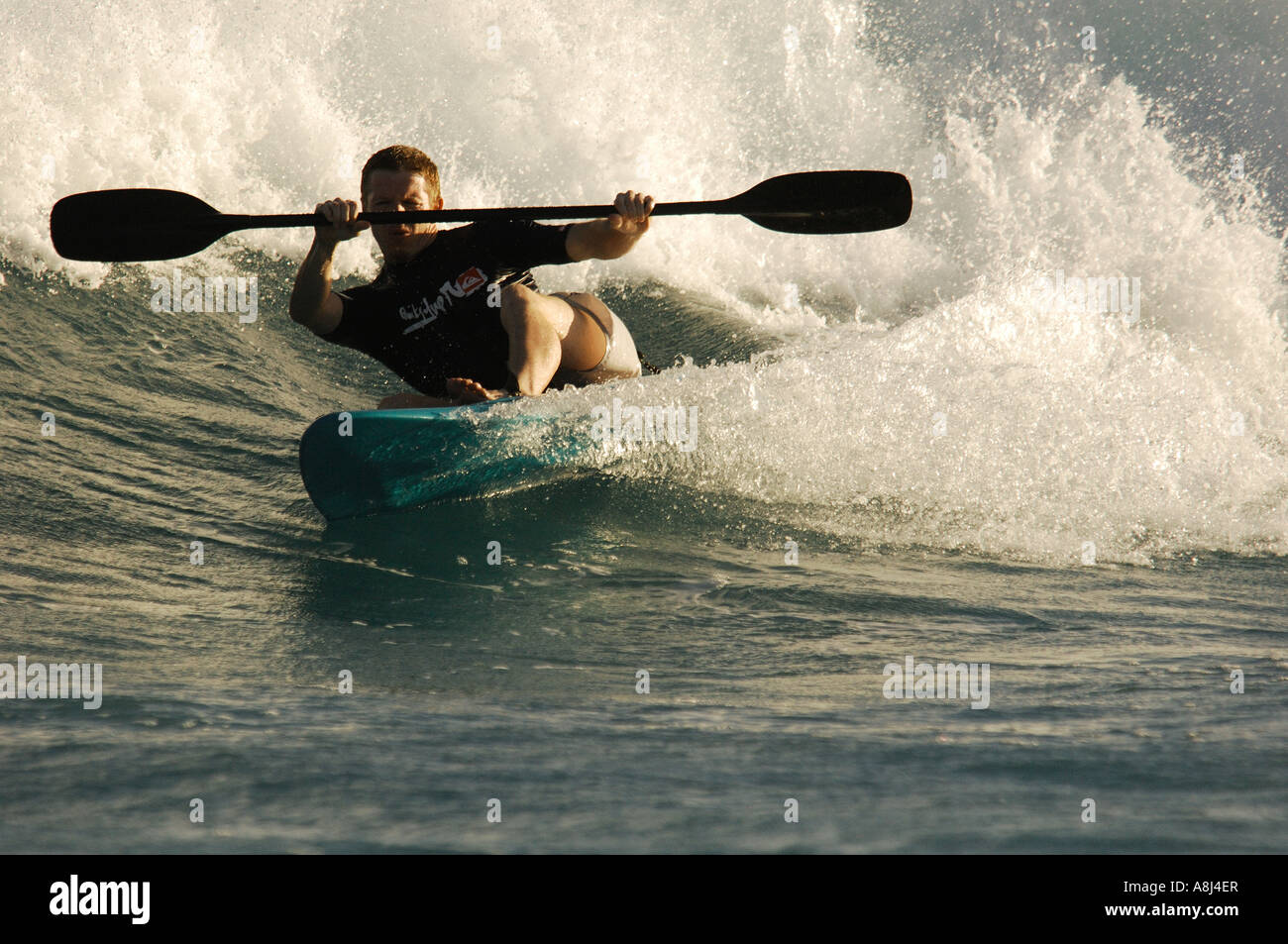 Kayak men in action in end of the day place Barbados Carribbean with ...