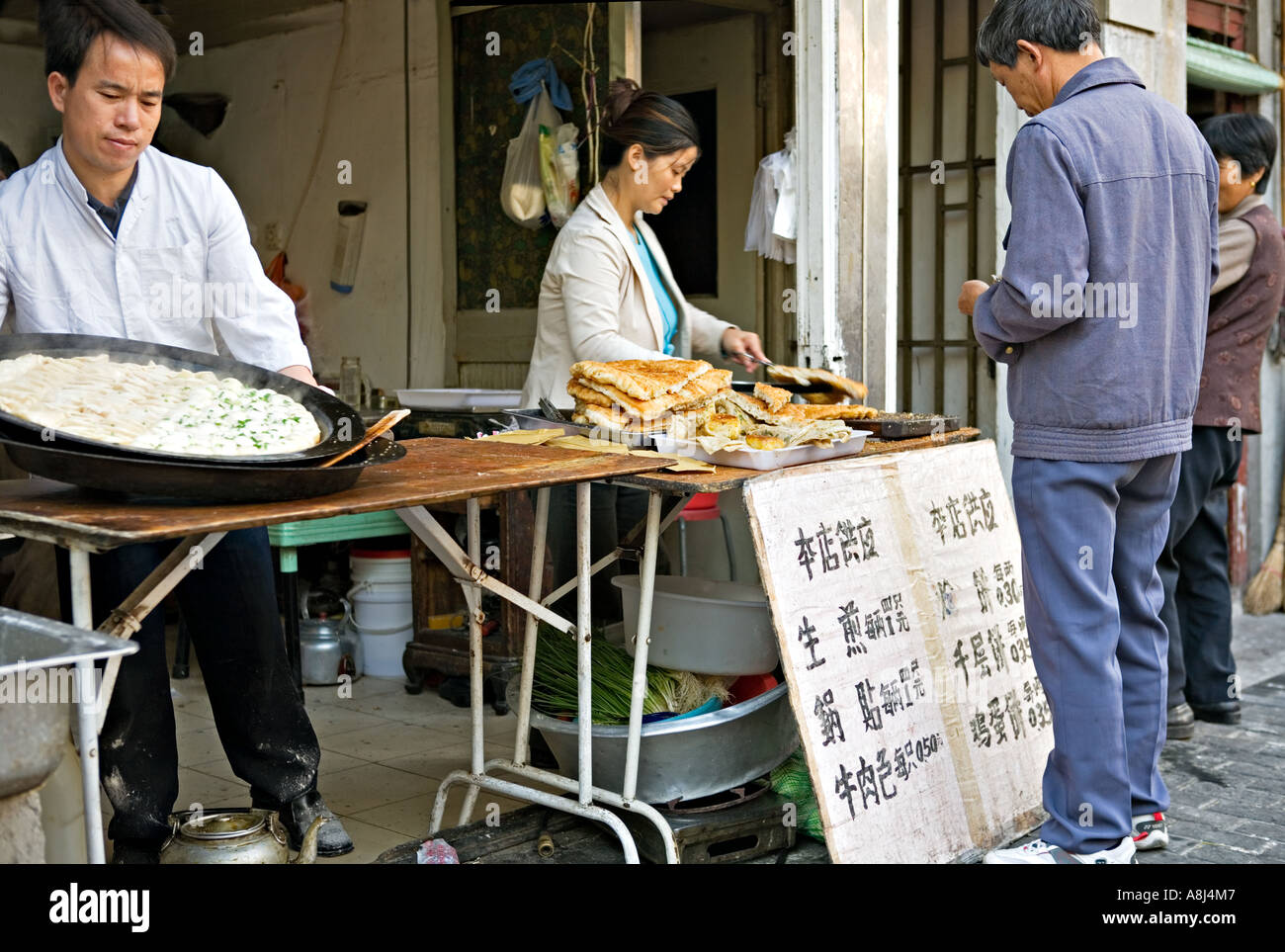 CHINA SHANGHAI Restaurant workers steaming breakfast dumplings and ...