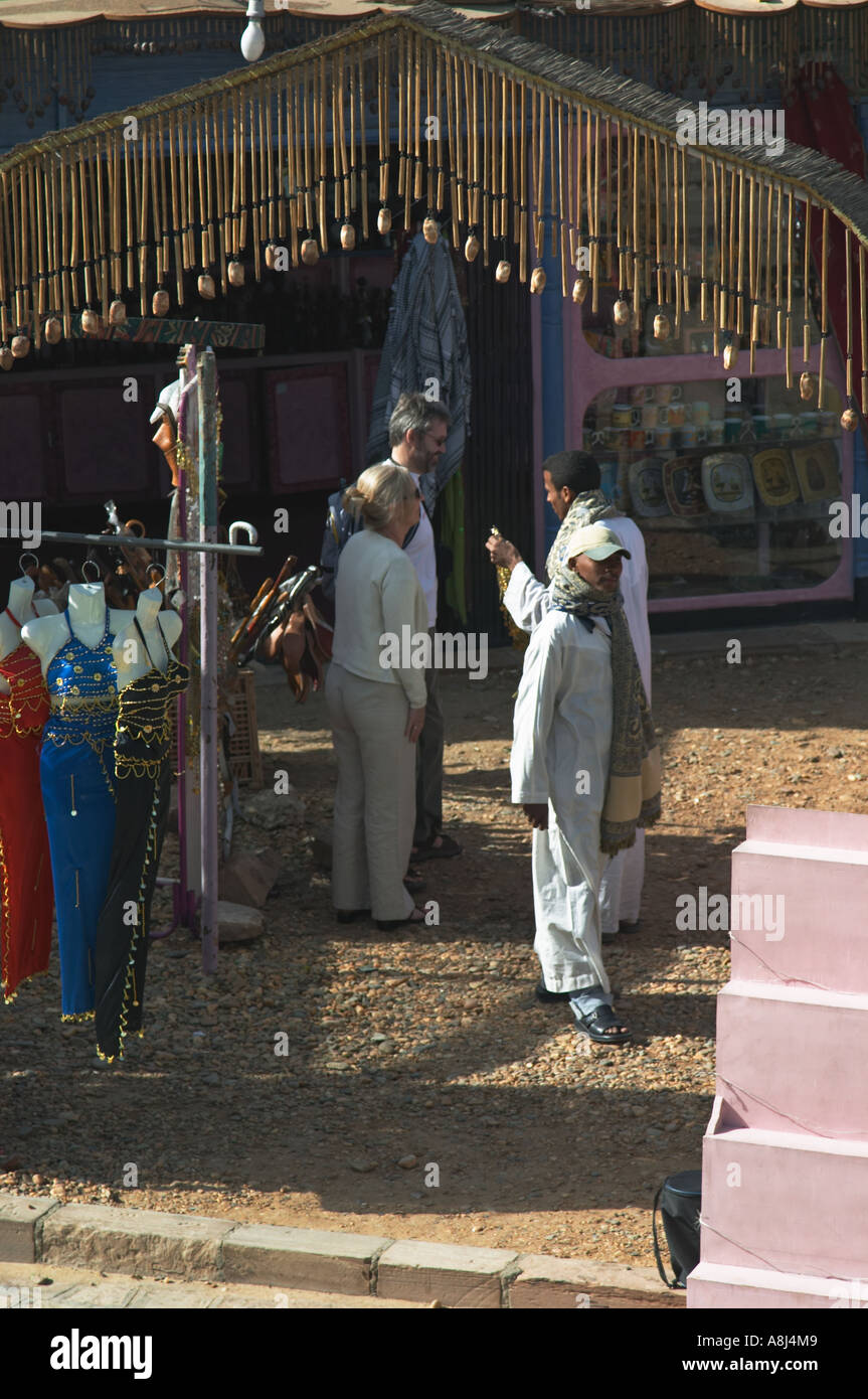 Tourist trading with market sellers Stock Photo - Alamy