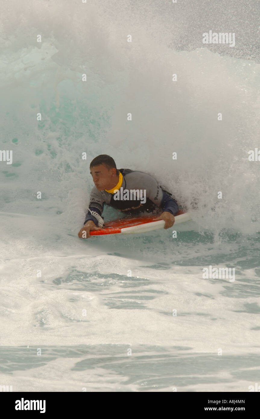 Men boogie boarding bodybording on the sea Gran Ganaria 2006 close shot ...
