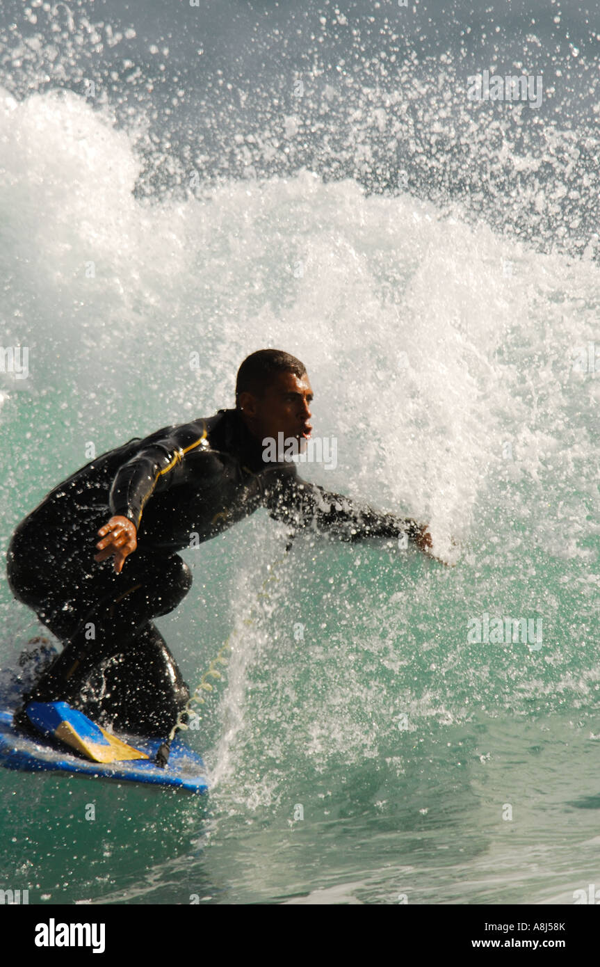 Men boogie boarding bodybording on the sea Gran Ganaria 2006 close shot ...