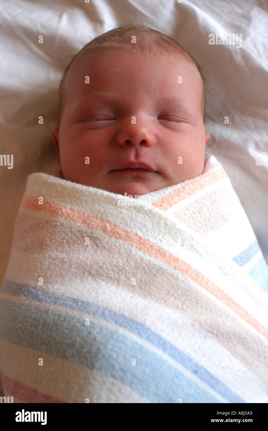 Newborn baby swaddled hi-res stock photography and images - Alamy
